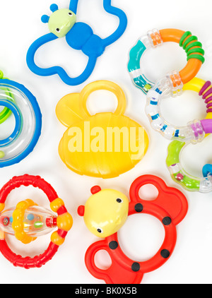A baby with a teether on a white background . Teething. Children's ...