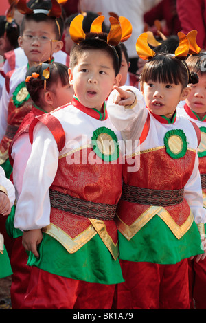 Children play as cows for the celebration of Chinese New Year Stock ...