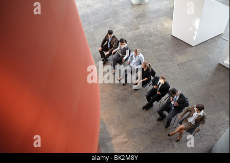 Business people waiting in line Stock Photo - Alamy