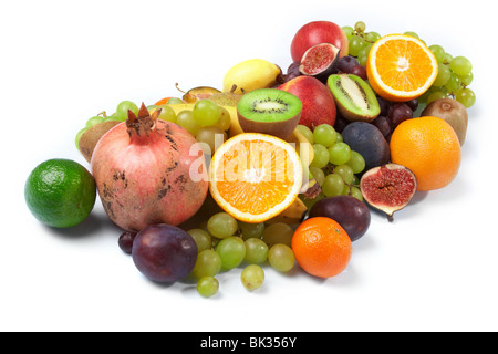 Organic orange tangerine, figs and grape fruit mix with green leaves ...