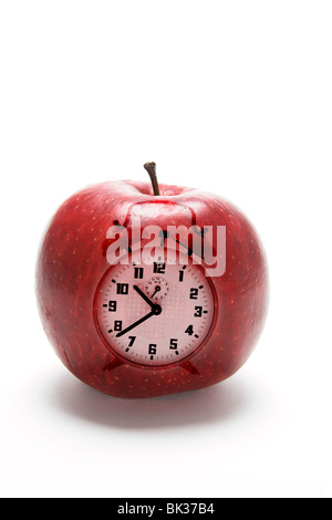 Fresh red apple with alarm clock and piggy bank Stock Photo - Alamy
