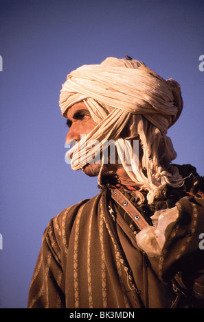 Berber man wearing traditional tuareg clothes in the Sahara Desert at ...
