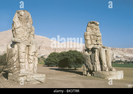 Colossus of Pharaoh Ramses II sitting on throne carved with ancient ...