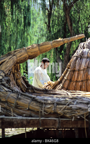Egypt a papyrus reed boat with man fishing in the Pharaonic Village in ...