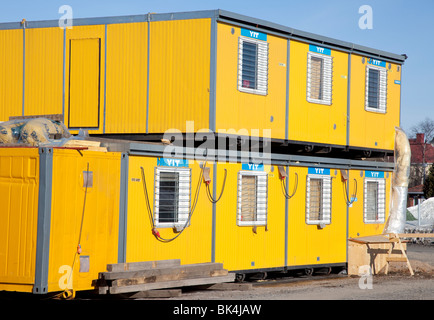 Construction site with temporary yellow barracks for construction ...