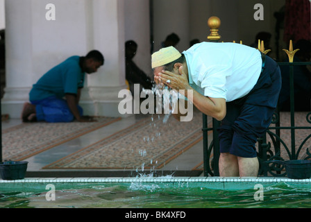 Muslim man washing before prayers at a mosque, Istanbul, Turkey Stock ...