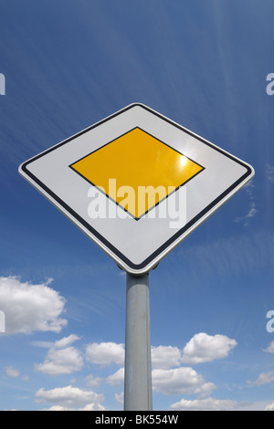 Eye - yellow sign with blue sky background Stock Photo - Alamy