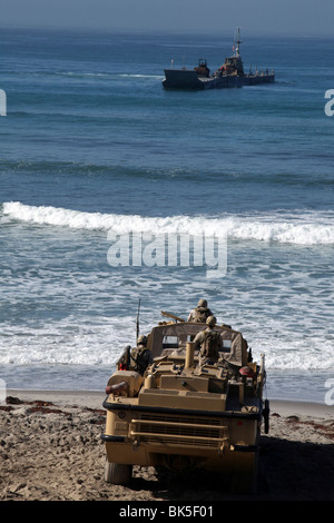 Improved Navy Lighterage System (INLS) Warping Tug 11 hip tows the INLS ...