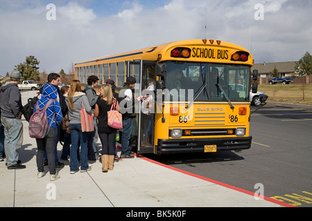 Students Getting On The School Bus Stock Photo - Alamy