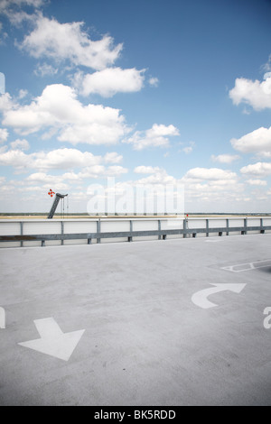 direction arrows on paved road at intersection, choice concept, go left ...