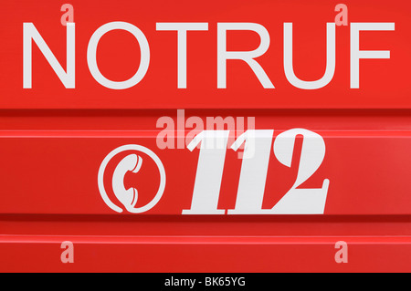 Sign, "Feuerwehr 112", German for "fire service 112", emergency ...