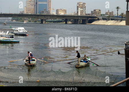 Fisher men are fishing in the dirty Nile in Cairo Stock Photo - Alamy