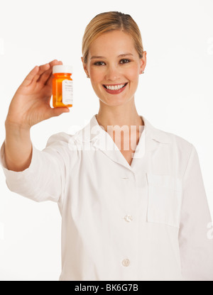 Female pharmacist looking for pills on computer Stock Photo - Alamy