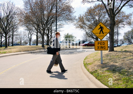 Walking or Pedestrian Sign near a road with a car on background Stock ...
