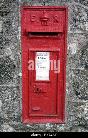 An Edward VII postbox in a stone wall Stock Photo - Alamy