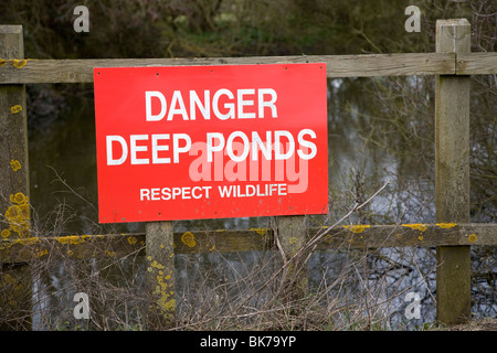 Danger deep ponds warning sign Stock Photo - Alamy