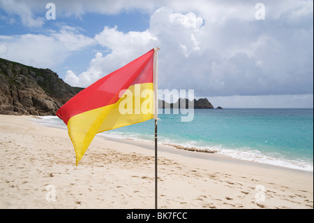 red & yellow flag on beach, Green Island, Great Barrier Reef ...