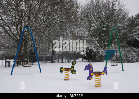 Childrens playground in the snow, Heston Park West London UK Stock ...