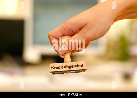Detail photo of a stamp with the inscription credit, background white ...