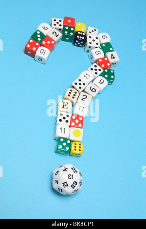 Game dice with question mark in the plant pot on wooden background ...