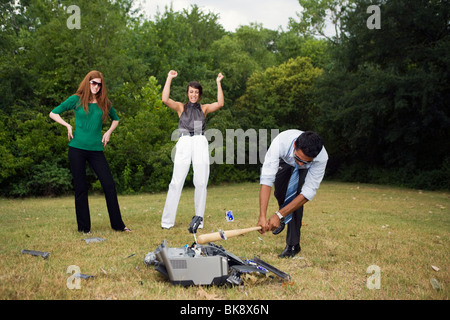 Businessman trashing a computer printer Stock Photo - Alamy
