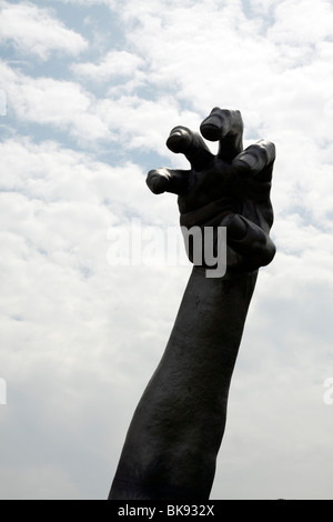 Hand emerging from the earth Stock Photo - Alamy