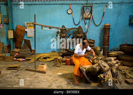 Indian Artisan works on an idol of the elephant-headed Hindu god Lord ...
