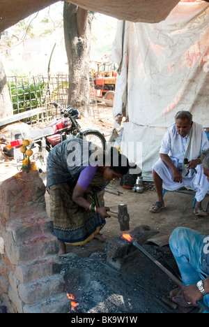 India, blacksmith home industry, forging iron Stock Photo - Alamy