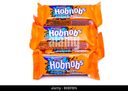 A packet of Mcvitie's milk chocolate Hobnobs biscuits on a white ...