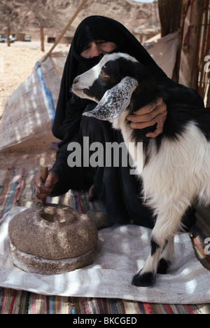 Bedouin woman with millstone Stock Photo - Alamy