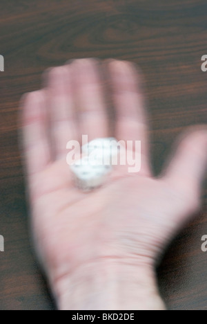 Hand rolling dice Stock Photo - Alamy