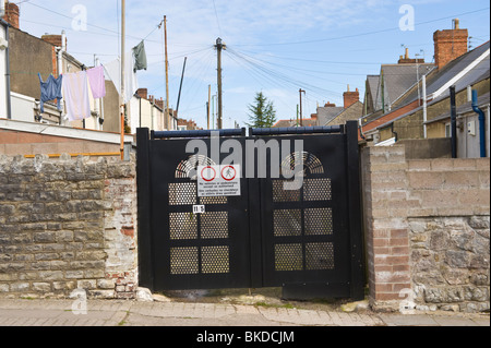 A back 'entry' (alleyway) between the rear of houses in Belfast Stock ...