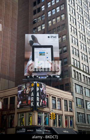Apple iPhone and iPad advertising billboard on a phone booth on 6th Ave ...