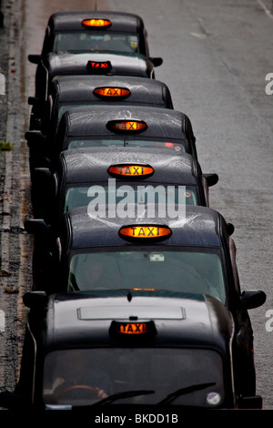 London taxis queuing at taxi rank showing the changing outward Stock ...