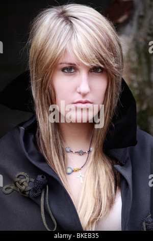 pretty blond girl portrait sulky in black Stock Photo - Alamy