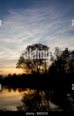 Sunset reflections over the water Stock Photo - Alamy