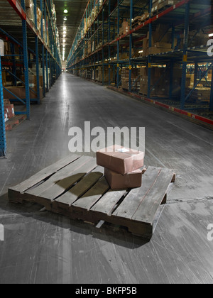 Big pile of boxes in distribution warehouse Stock Photo - Alamy