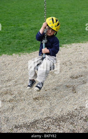 young boy riding playground ropeway Stock Photo - Alamy