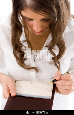 Woman holding a checkbook and pen poised to write a check Stock Photo ...