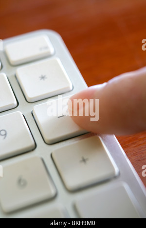 The minus key on an Apple Mac keyboard Stock Photo - Alamy