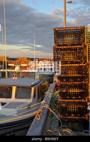 Commercial fishing wharf with lobster traps and lobster boats at ...