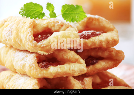 rolls of puff pastry with fruit jam Stock Photo - Alamy