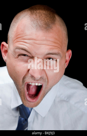 Portrait of angry man with shaved head shocked by haircut and ...