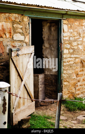 Rustic stone cow-shed or byre with corrugated tin roof. Midlands ...