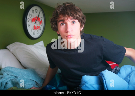 A Teenage Boy Getting Out Of Bed Late Stock Photo - Alamy