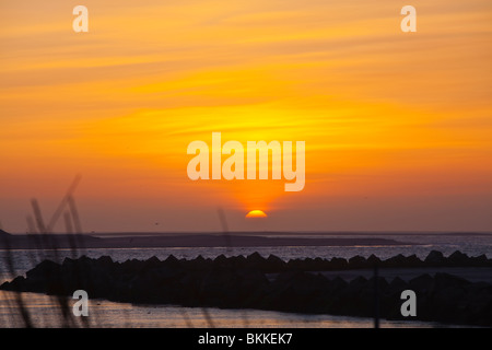 Orange volcanic dust sunset at Dutch coastal area Stock Photo - Alamy