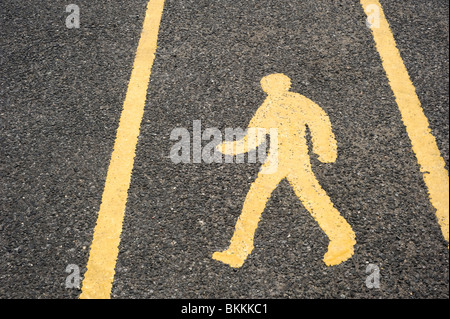 Yellow Pedestrian Walkway Sign painted on a Tarmac Road Surface in a ...