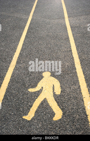Pedestrian symbol painted on sidewalk Stock Photo - Alamy