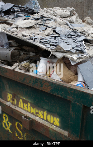 Building work waste in a skip awaiting removal, with NO ASBESTOS sign ...