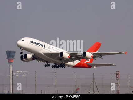 Qantas Airbus A380 taking off at London Heathrow Airport at night Stock ...